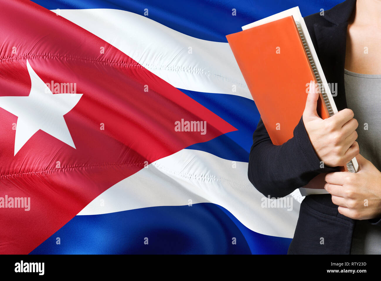 Learning Cuban language concept. Young woman standing with the Cuba ...