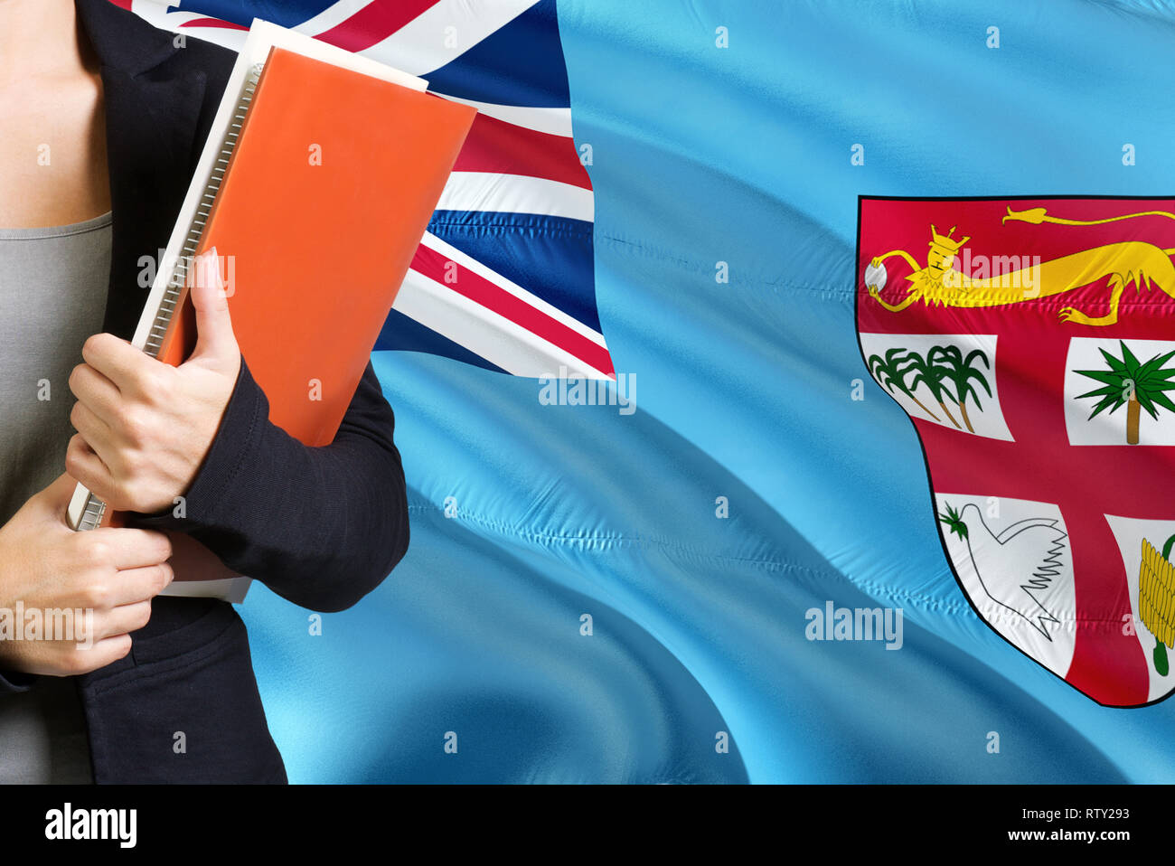 Learning Fijian language concept. Young woman standing with the Fiji ...