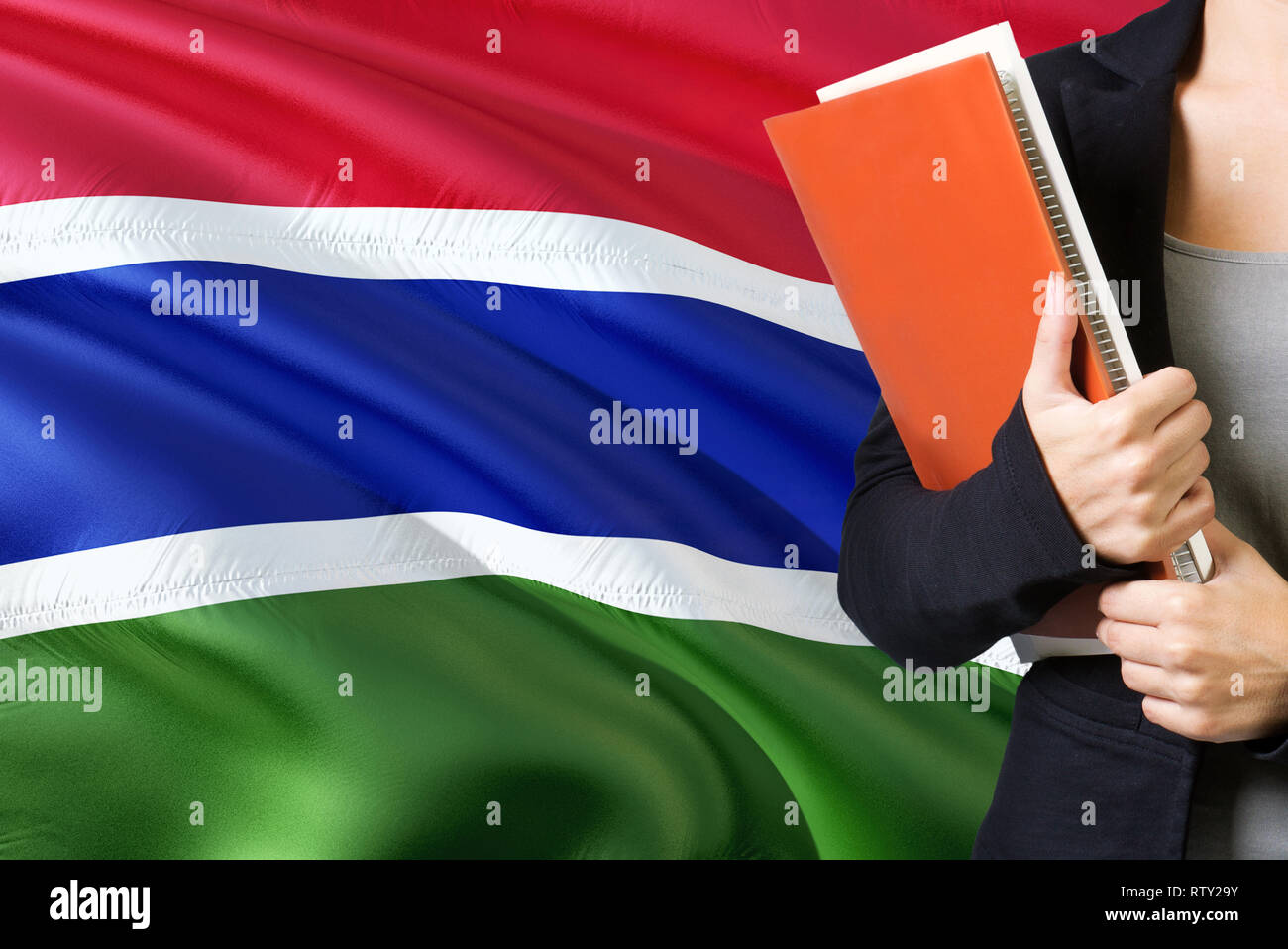 Learning Gambian language concept. Young woman standing with the Gambia ...