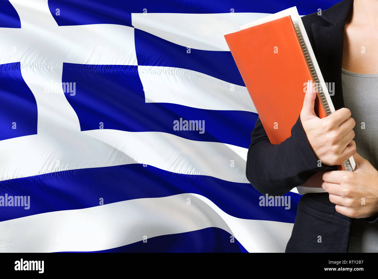 Learning Greek language concept. Young woman standing with the Greece ...
