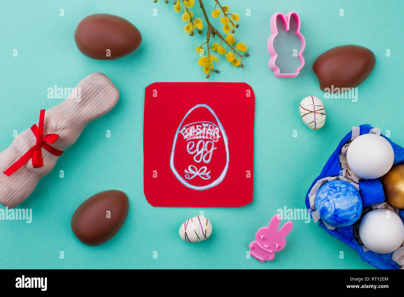 Easter background with sweets and eggs. Picture of egg on red card ...