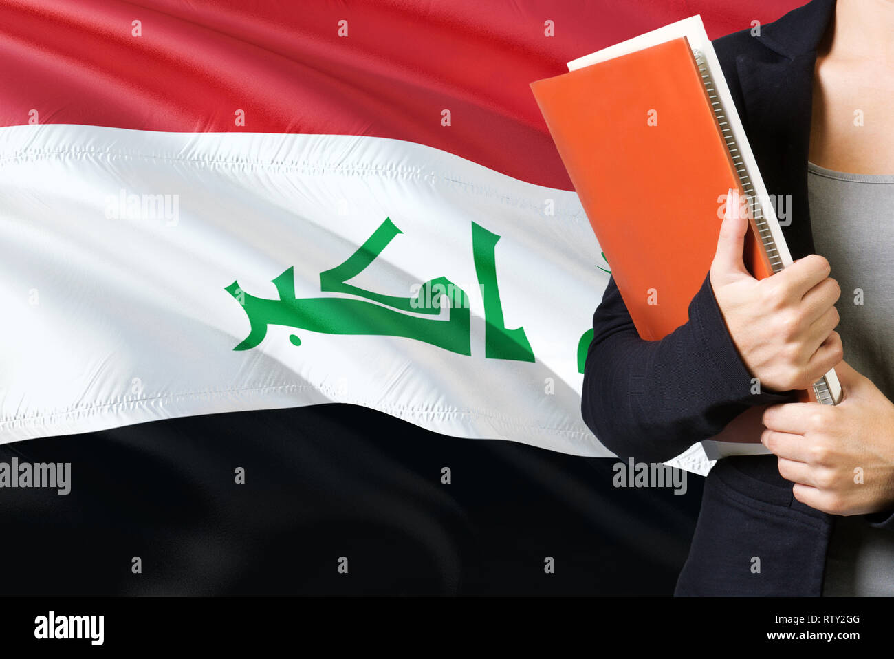 Learning Iraqi language concept. Young woman standing with the Iraq ...