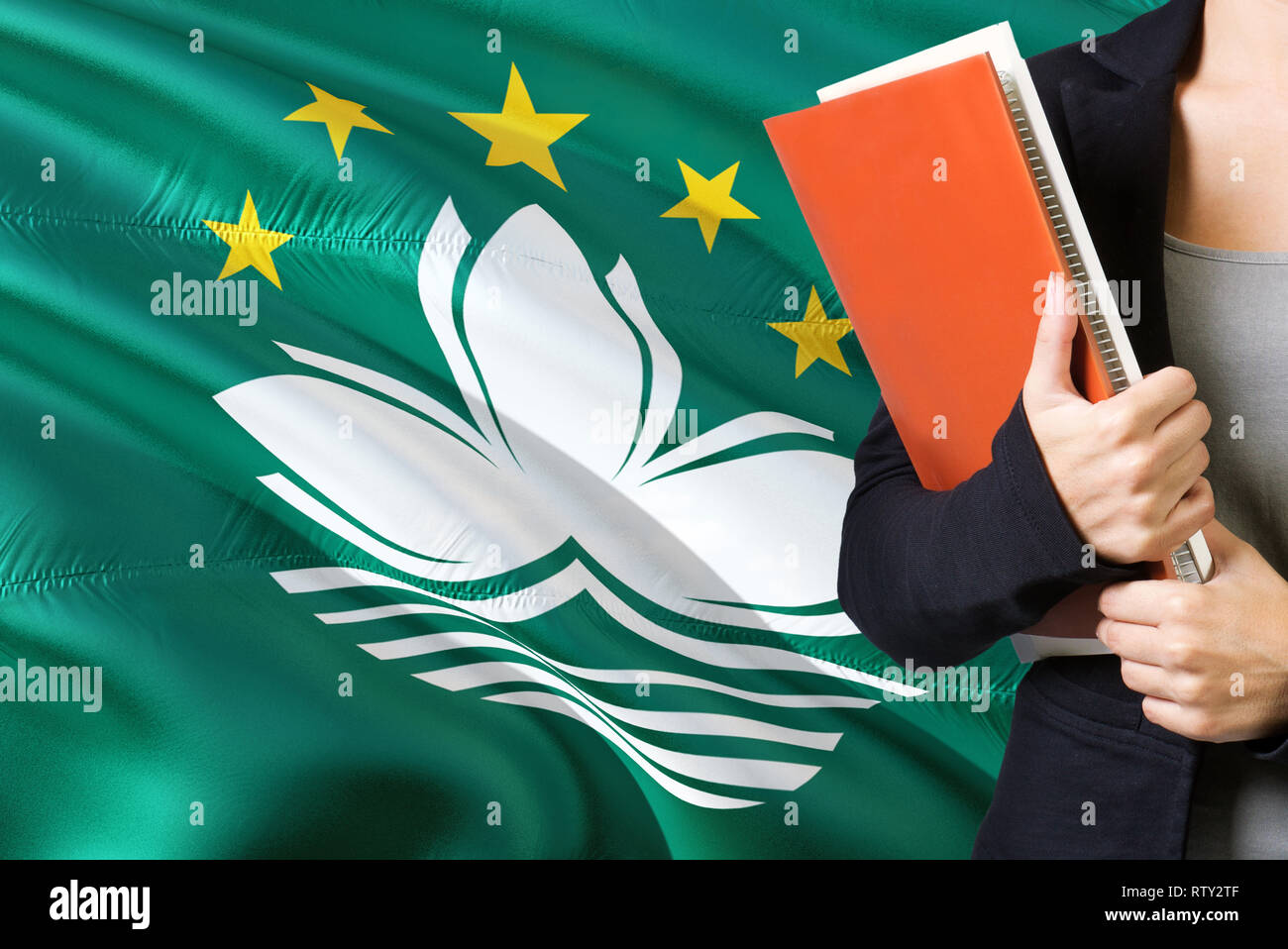 Learning Macau language concept. Young woman standing with the Macao ...