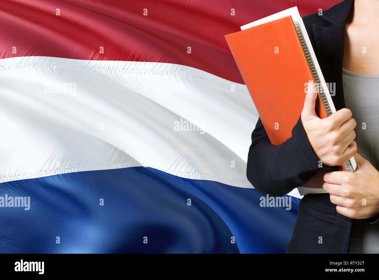 Learning Dutch language concept. Young woman standing with the ...