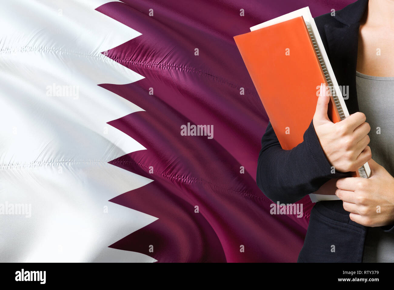 Learning Qatari language concept. Young woman standing with the Qatar ...