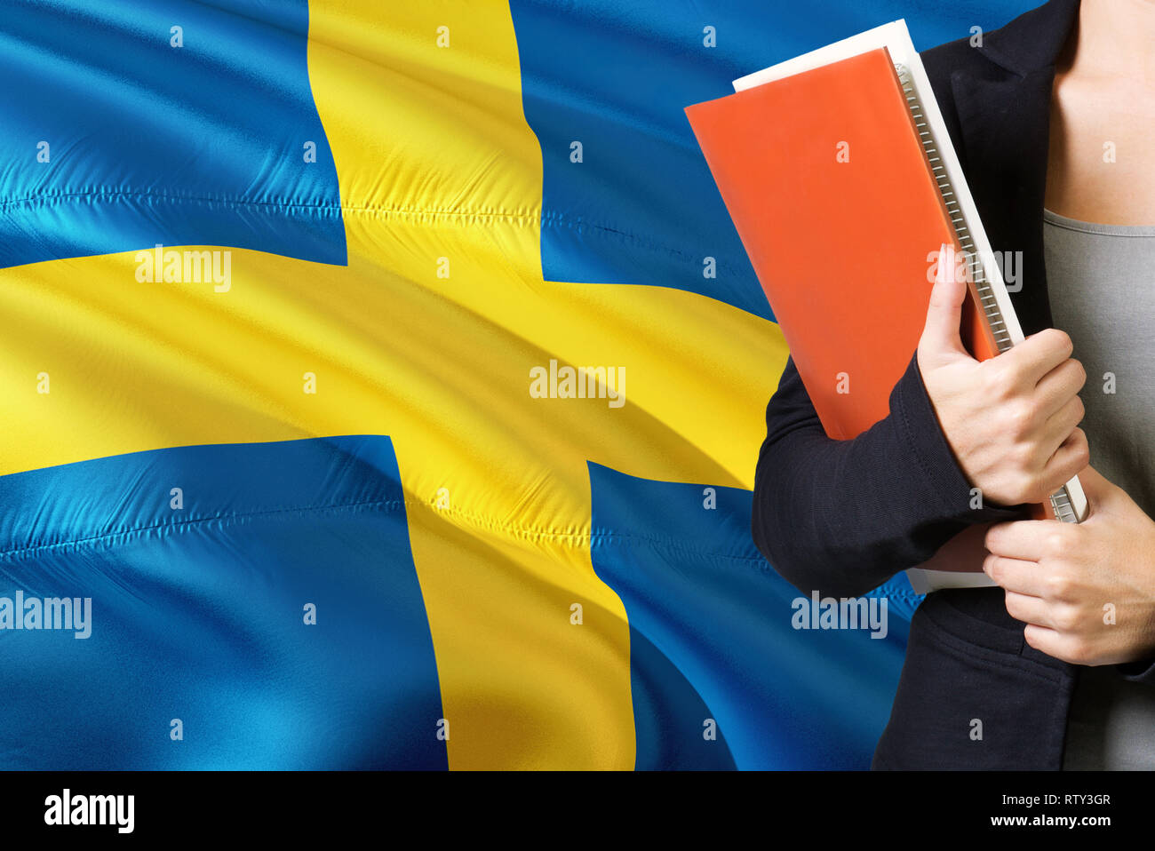 Learning Swedish language concept. Young woman standing with the Sweden ...