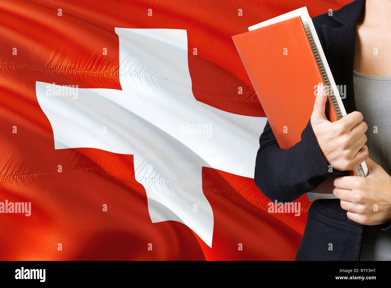 Learning Swiss language concept. Young woman standing with the ...