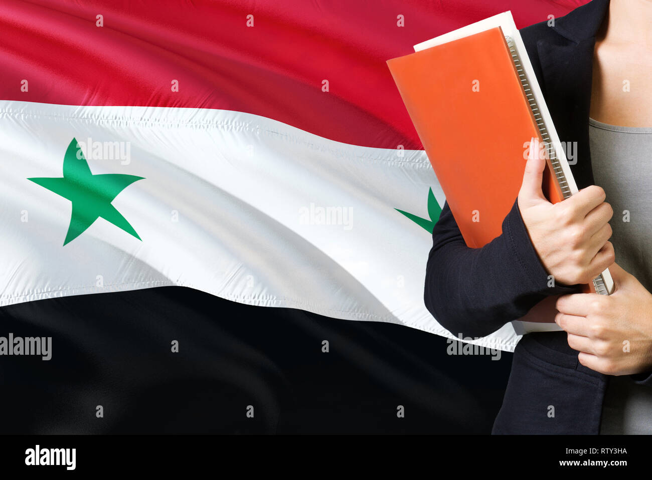 Learning Syrian language concept. Young woman standing with the Syria ...