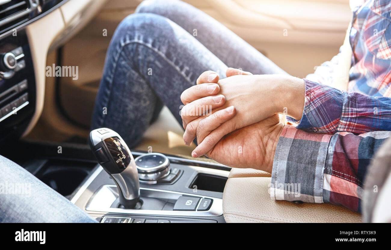Young man change speed, shifting gears holding hand on gearbox together ...