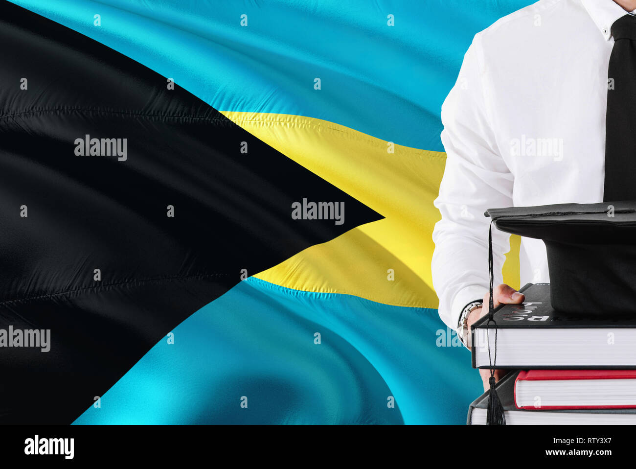 Successful Bahamian student education concept. Holding books and ...