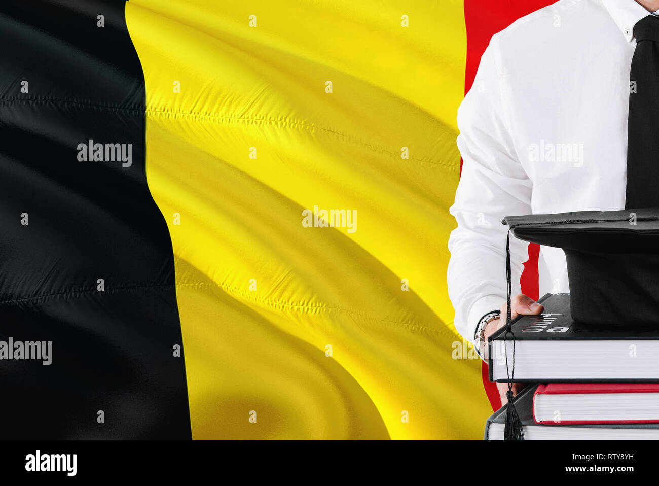 Successful Belgian student education concept. Holding books and ...