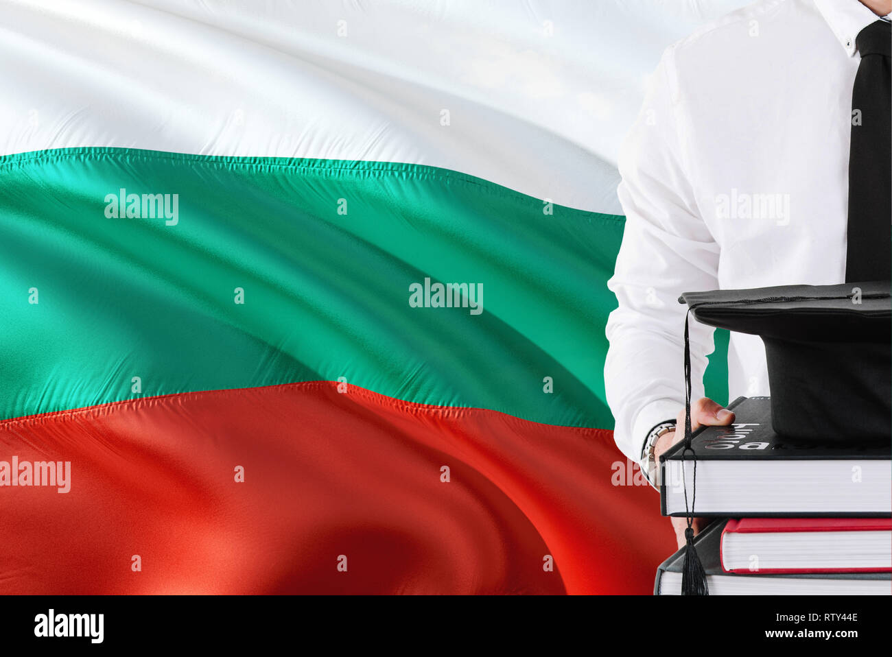 Successful Bulgarian student education concept. Holding books and ...