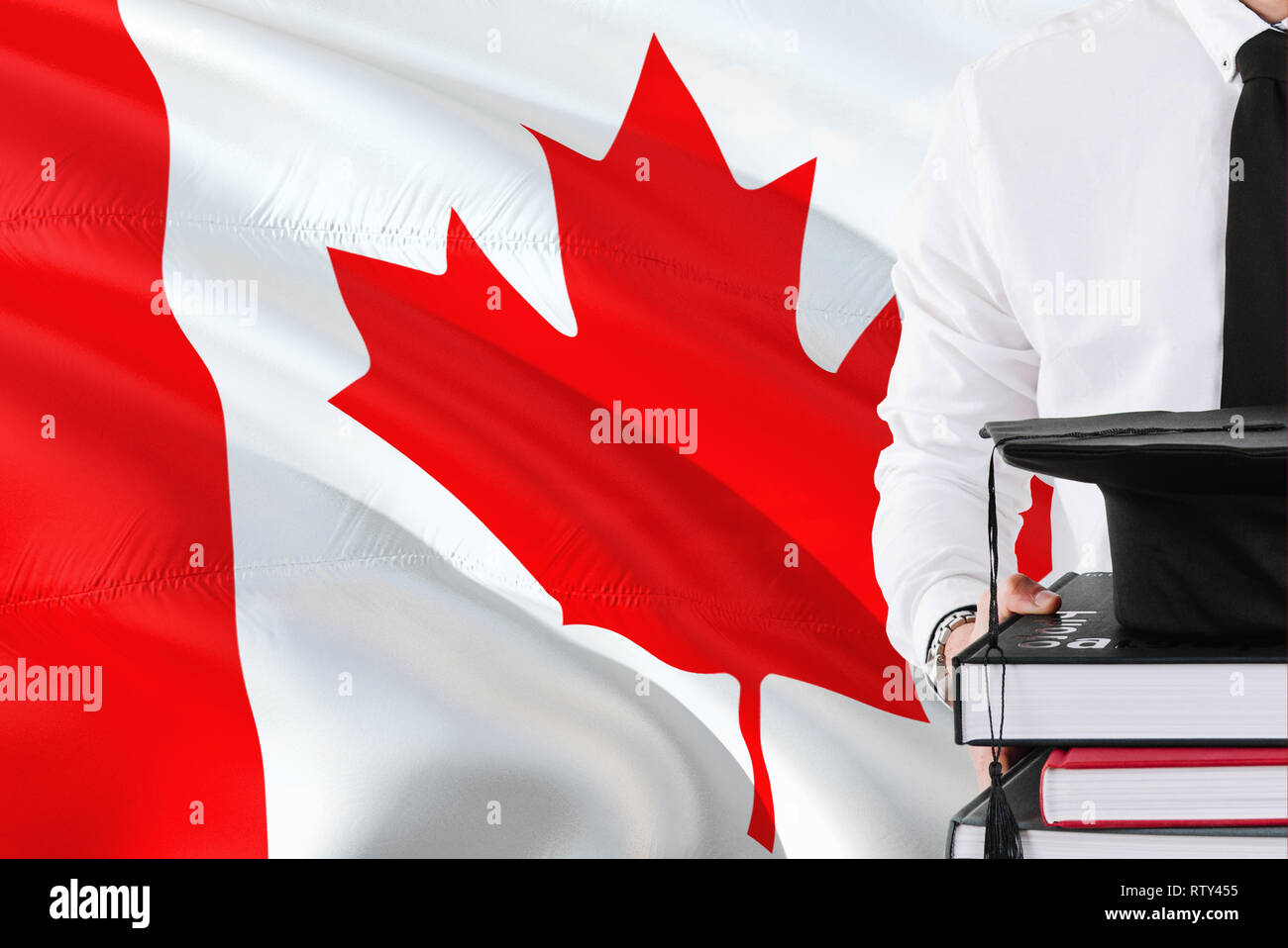 Successful Canadian student education concept. Holding books and ...
