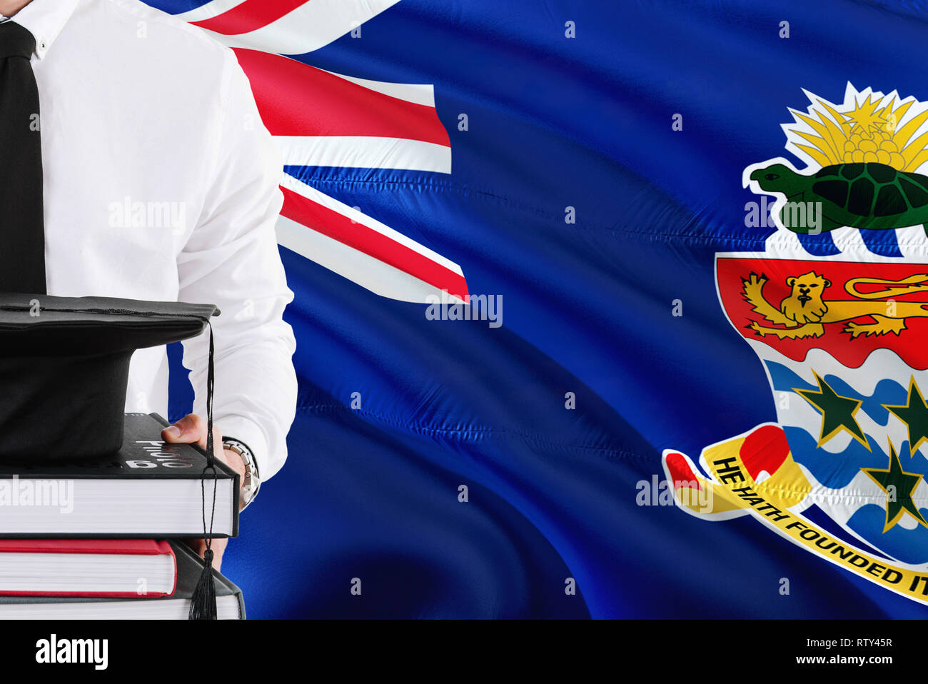 Successful student education concept. Holding books and graduation cap ...