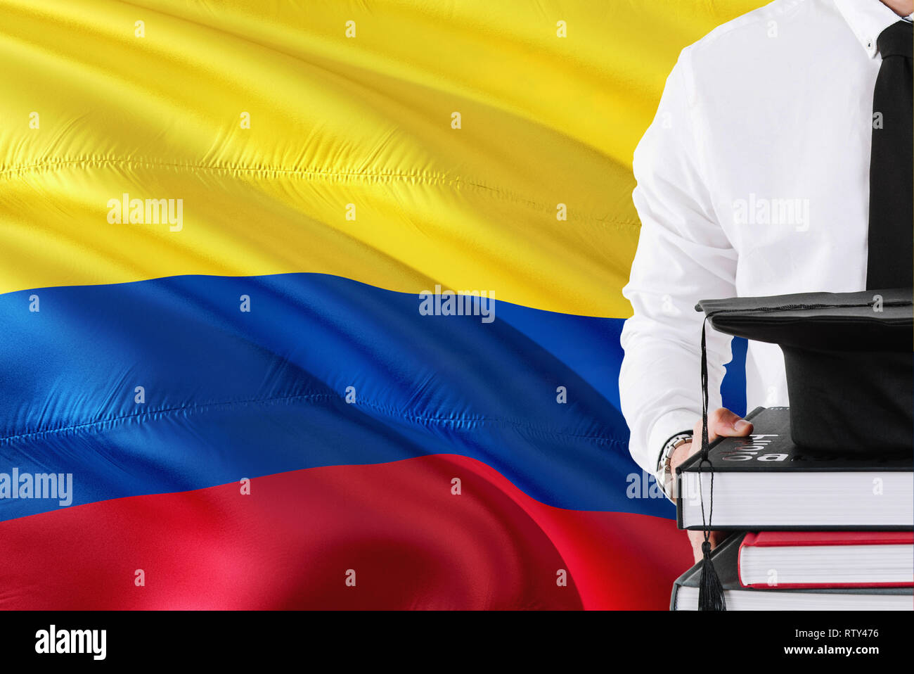Successful Colombian student education concept. Holding books and ...