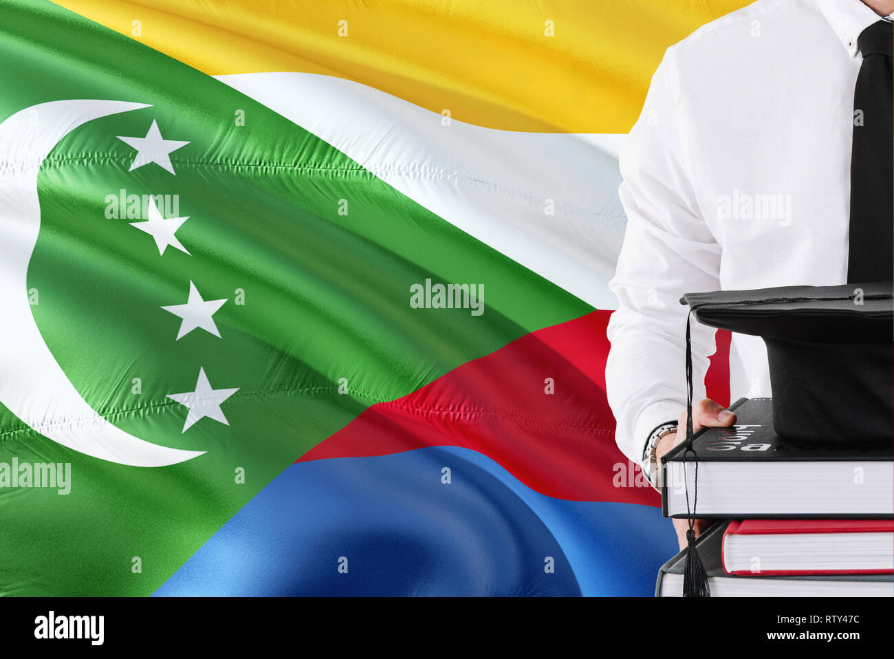 Successful Comoran student education concept. Holding books and ...