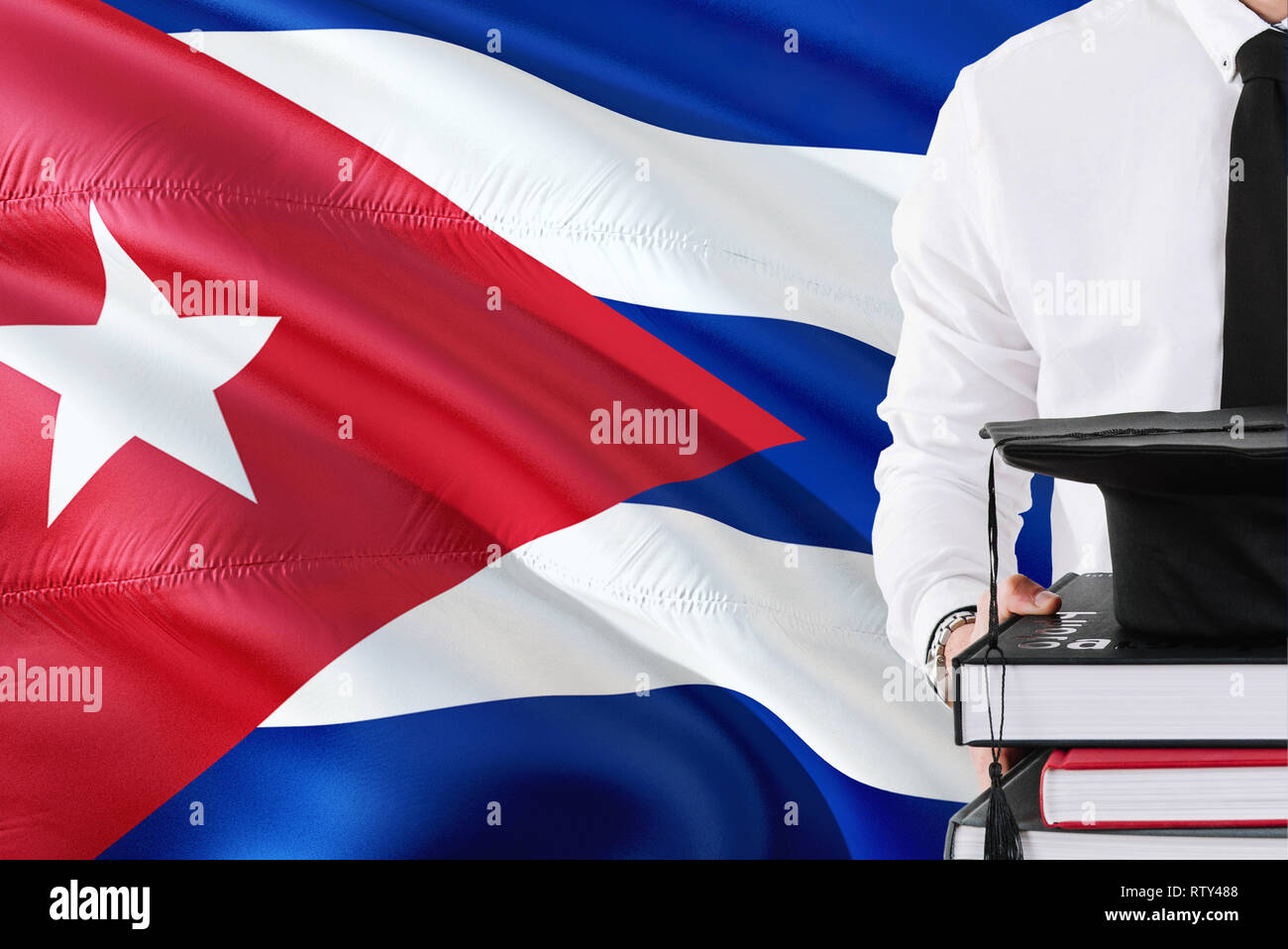 Successful Cuban student education concept. Holding books and ...