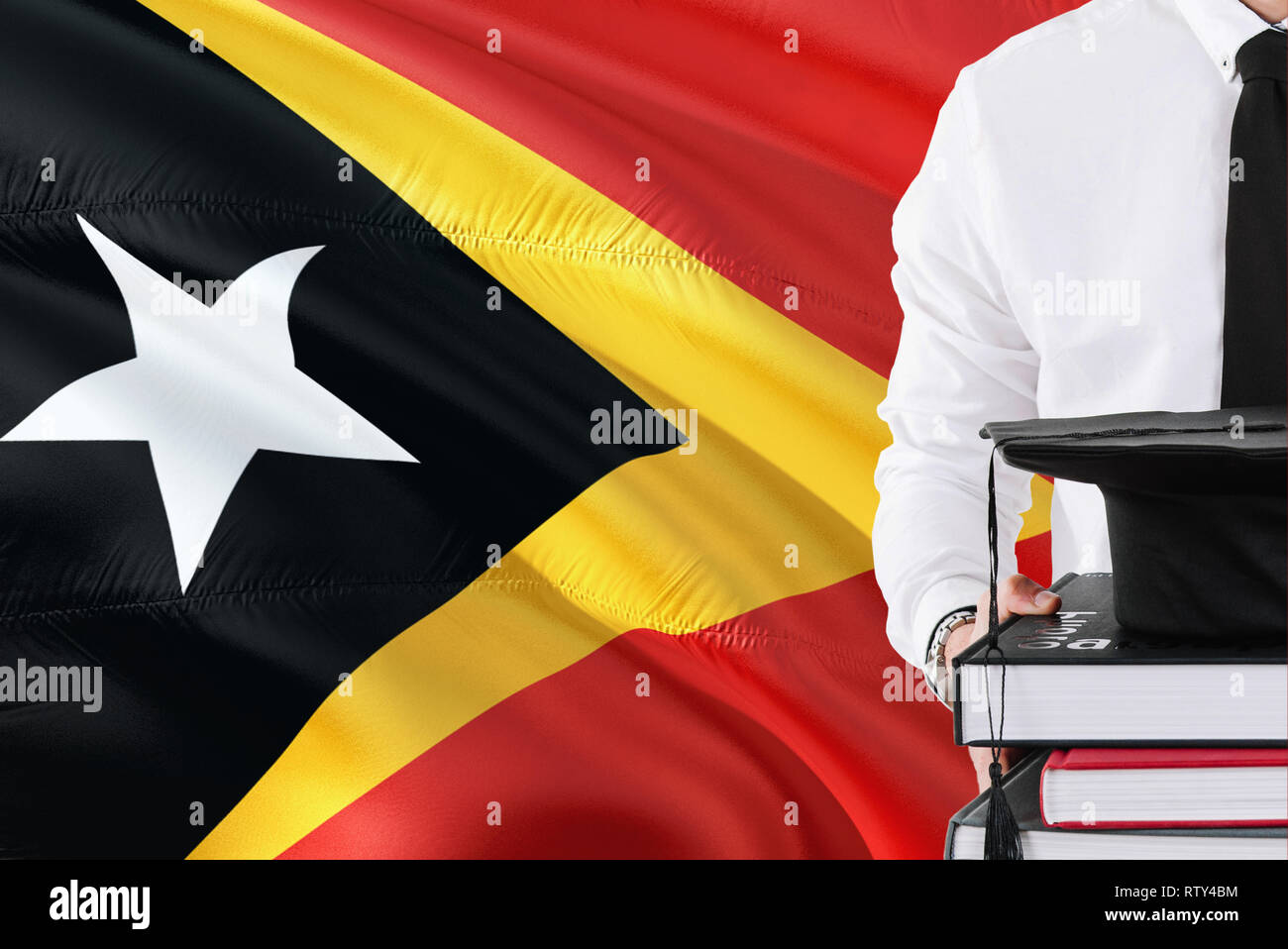 Successful Timorese student education concept. Holding books and ...