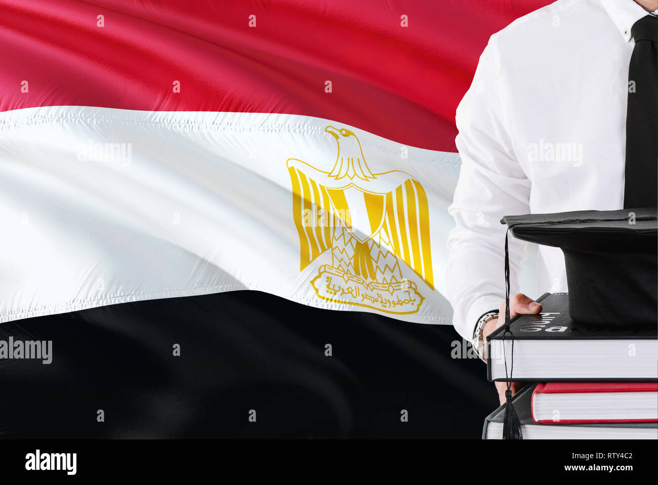 Successful Egyptian student education concept. Holding books and ...