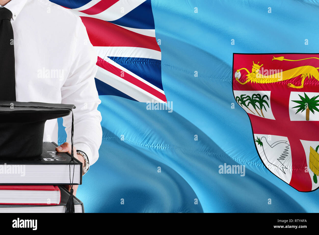Successful Fijian student education concept. Holding books and ...