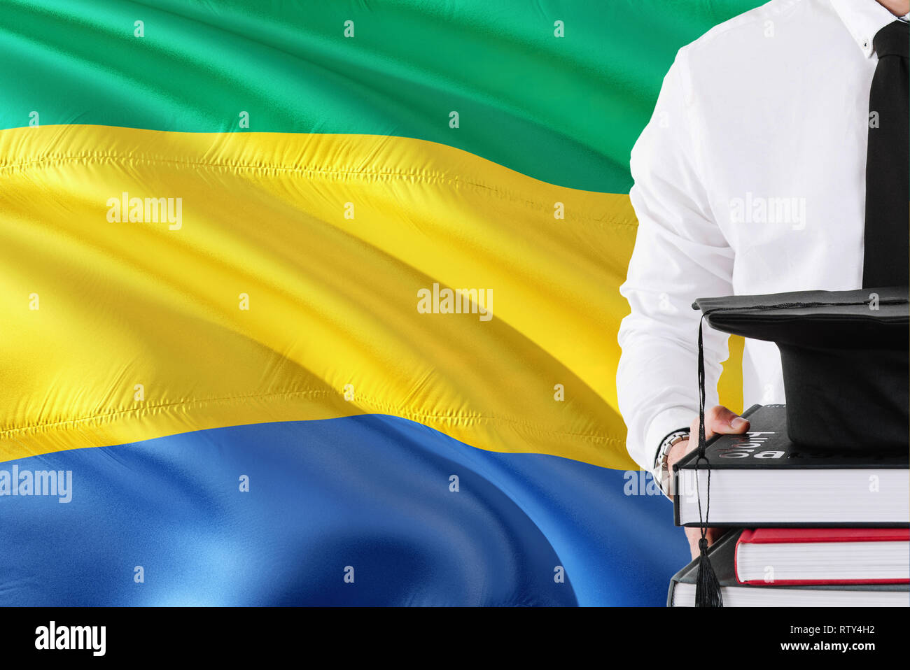 Successful Gabonese student education concept. Holding books and ...