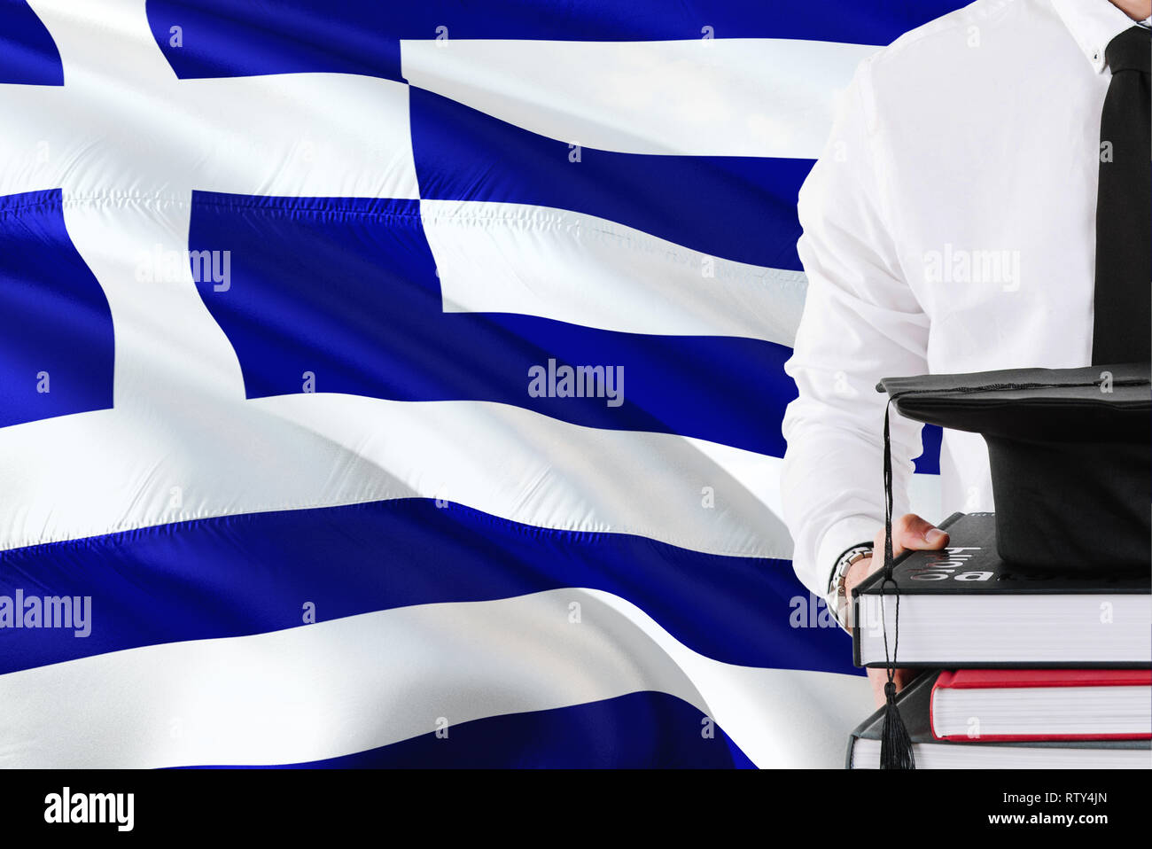 Successful Greek student education concept. Holding books and ...