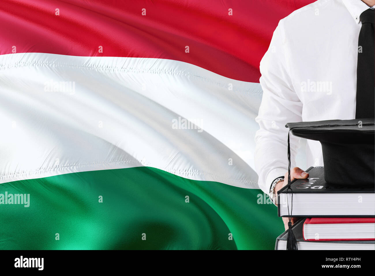 Successful Hungarian student education concept. Holding books and ...