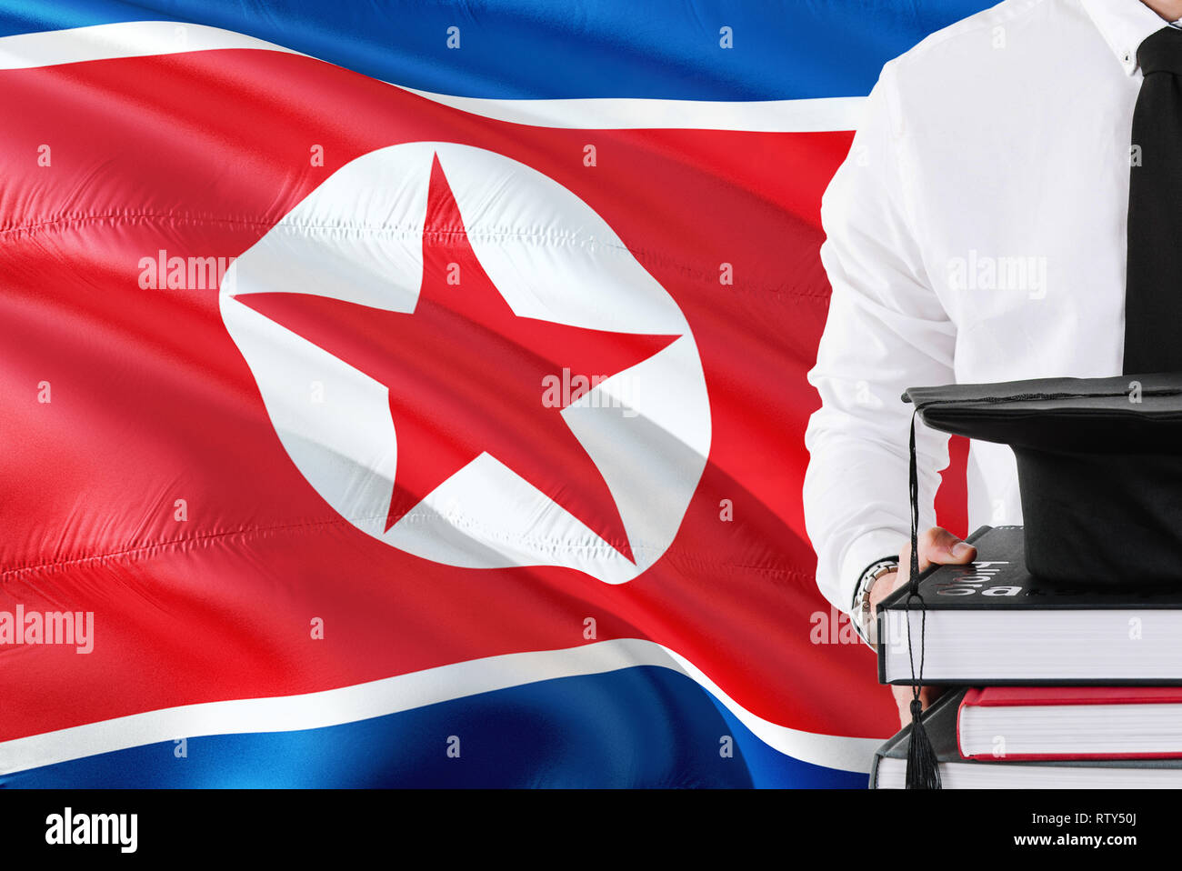 Successful North Korean student education concept. Holding books and ...