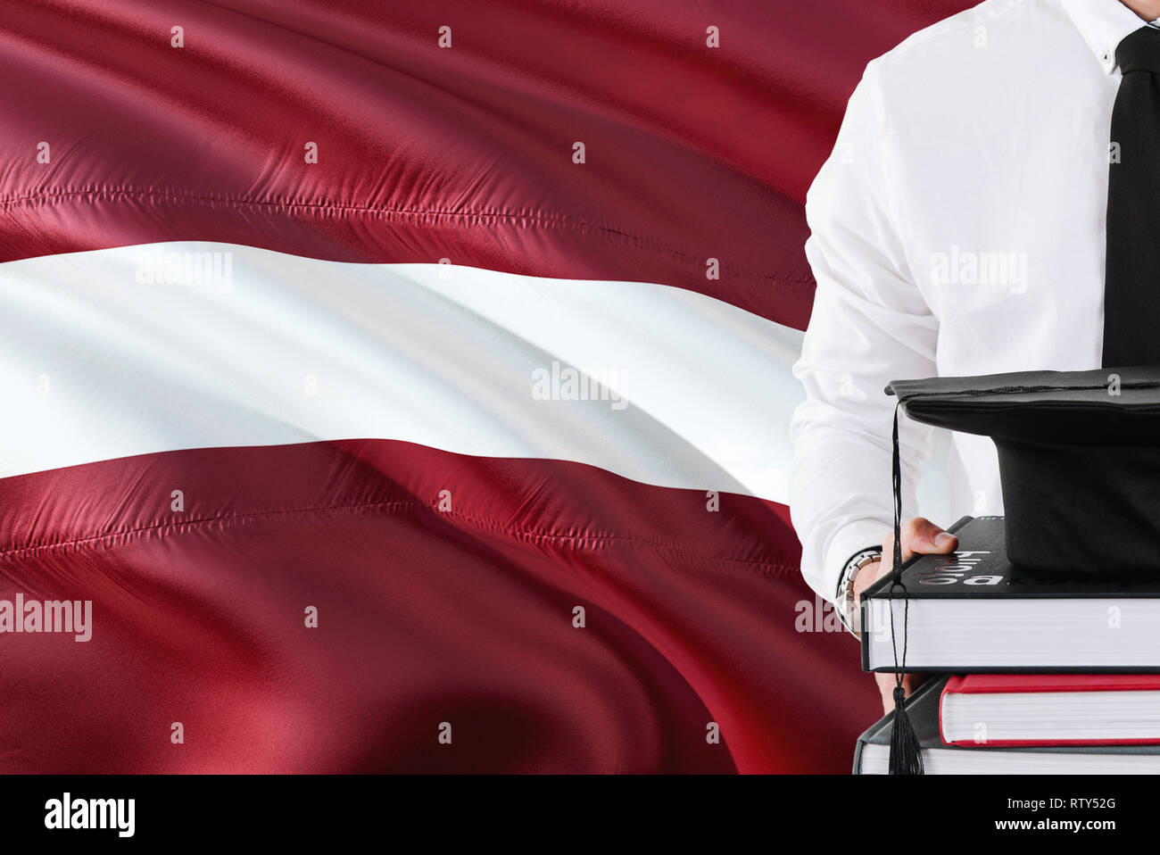 Successful Latvian student education concept. Holding books and ...