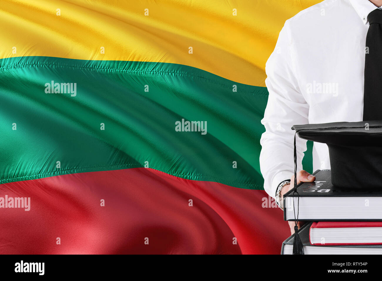 Successful Lithuanian student education concept. Holding books and ...