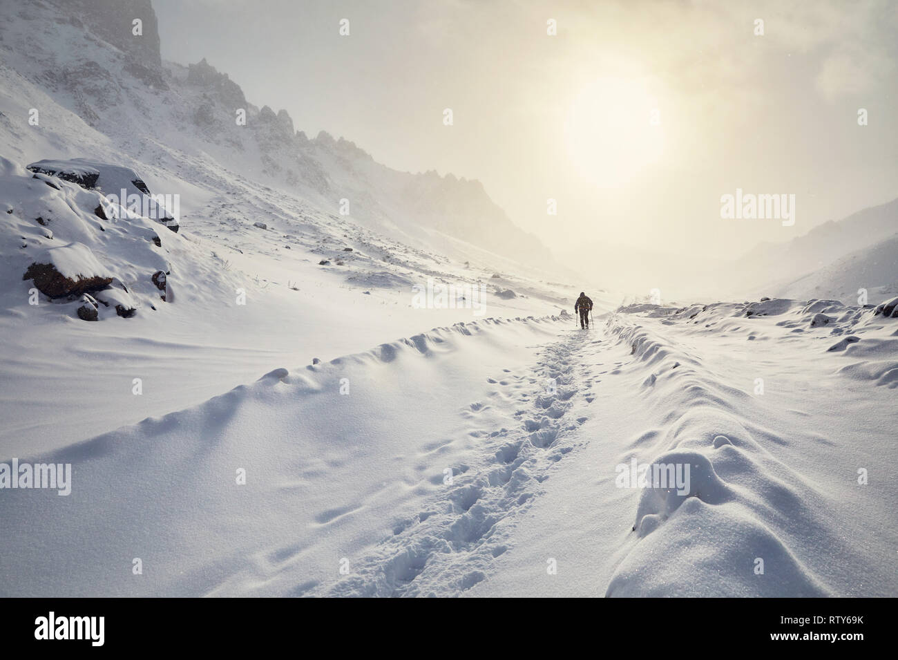 Tourist on the snow road in the beautiful mountains at winter Stock ...