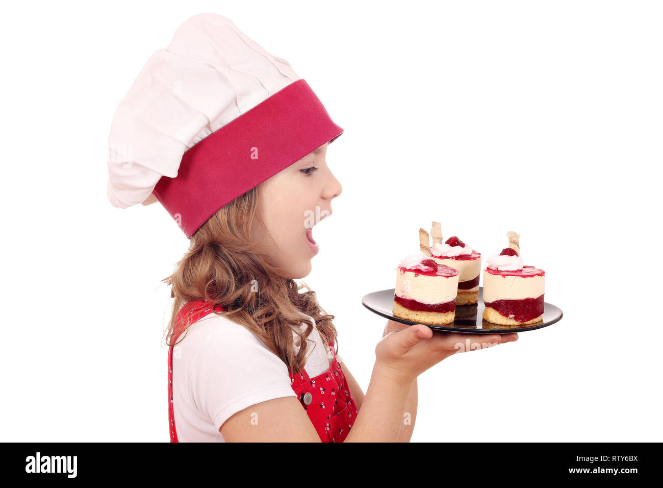 happy little girl cook with raspberry cake dessert Stock Photo - Alamy