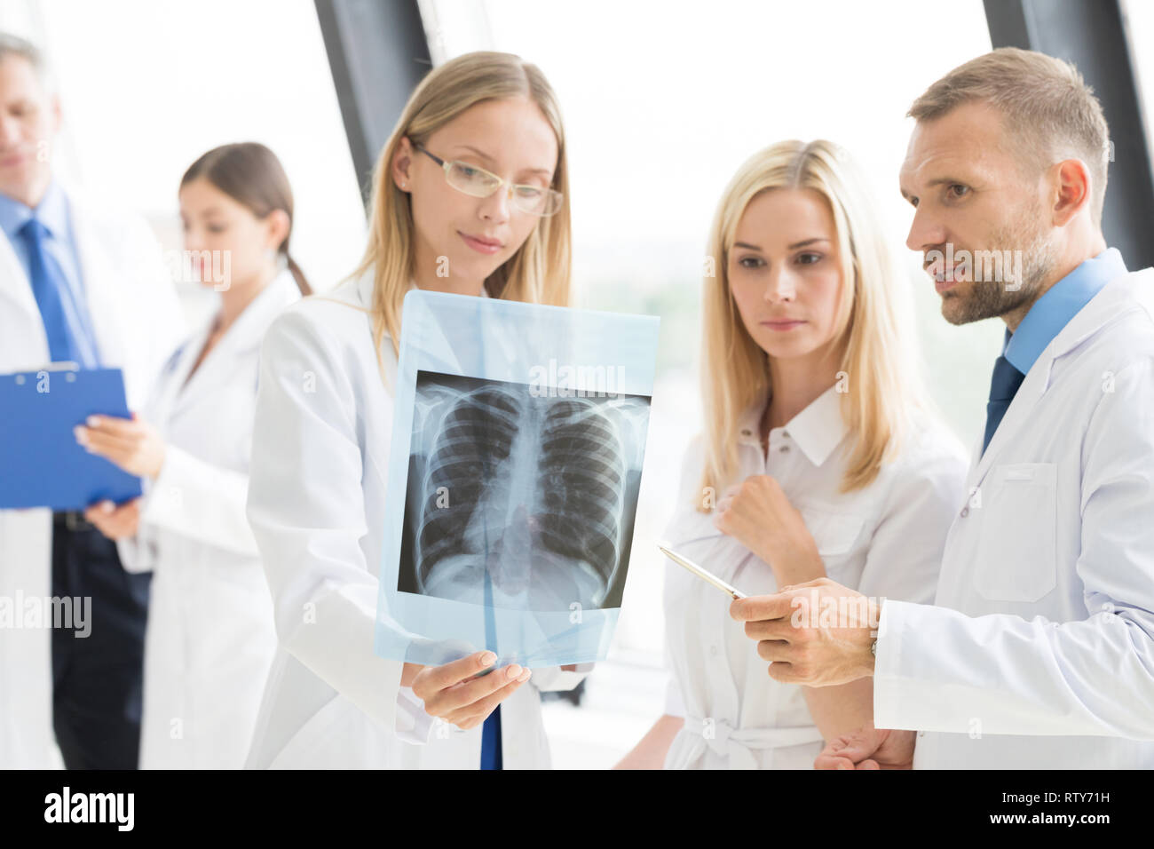 Clinic, people, healthcare and medicine concept - group of medics with ...