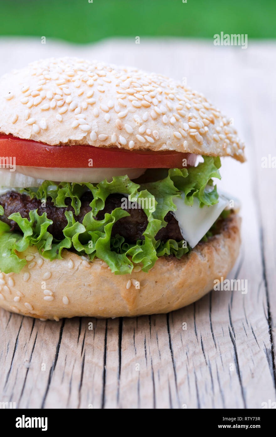 Fresh home-made hamburger served on wood Stock Photo - Alamy