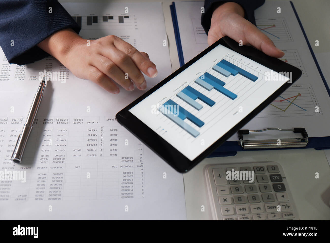 Women working in office. financial analysis with charts on pad for ...