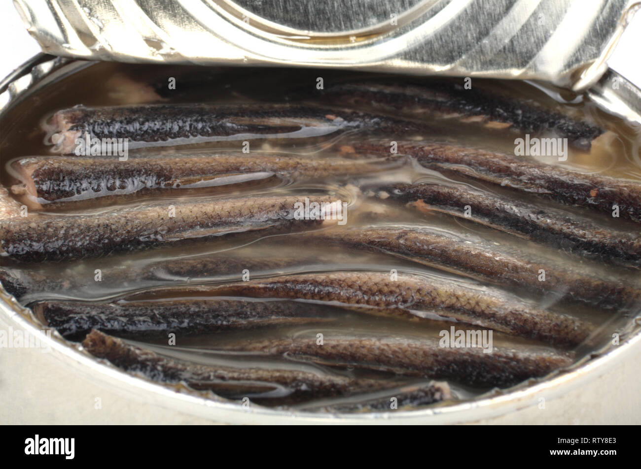 canned fish in open tin Stock Photo - Alamy