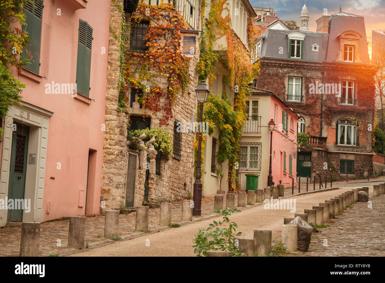 Montmartre, France. Street with houses. Sunset in Paris Stock Photo - Alamy