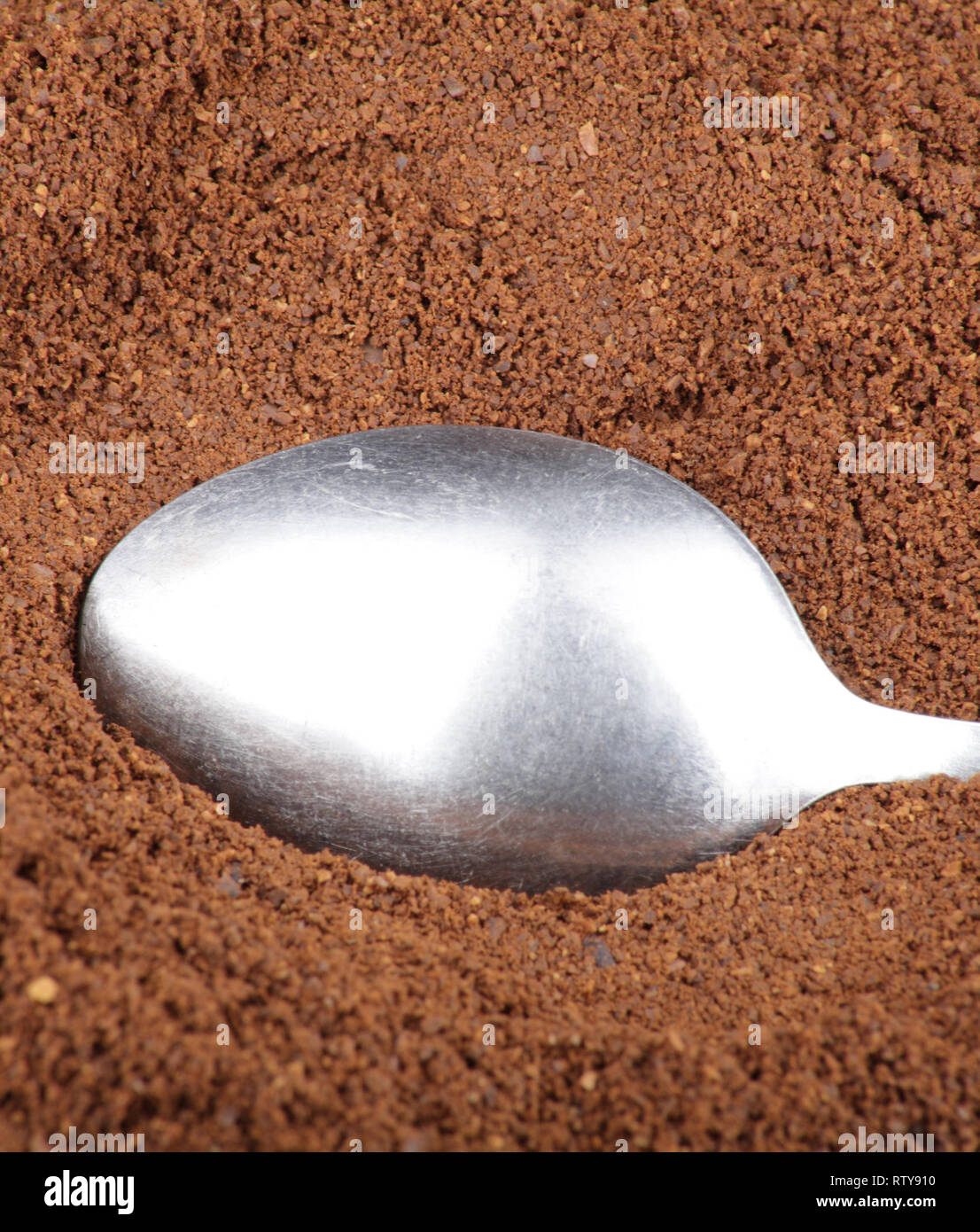 milled coffee and one teaspoon Stock Photo - Alamy