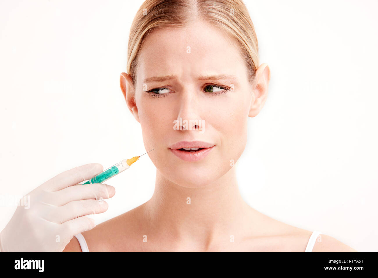 Close-up portrait shot of worried face young woman having botox ...