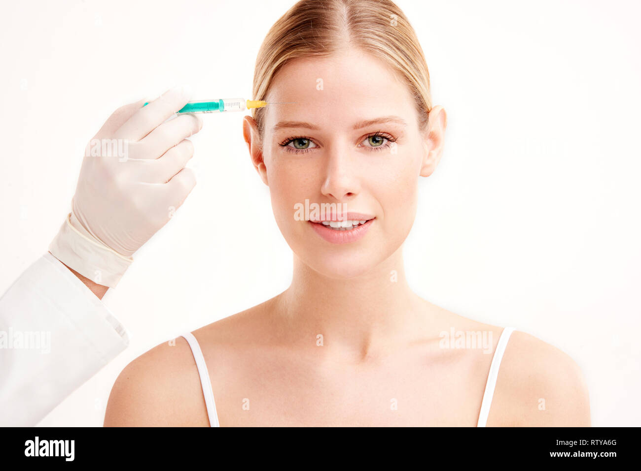 Close-up portrait shot of beautiful young woman having botox on her ...
