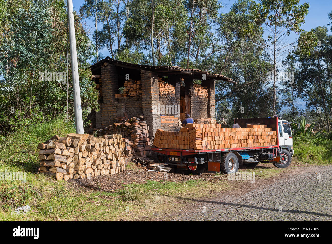 Truck loads bricks directly from the wood furnace Stock Photo - Alamy