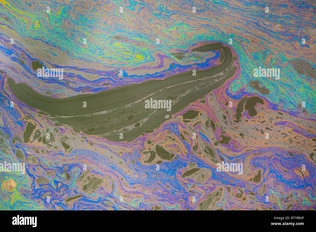 Abstract image of an oil film on calm water Stock Photo - Alamy
