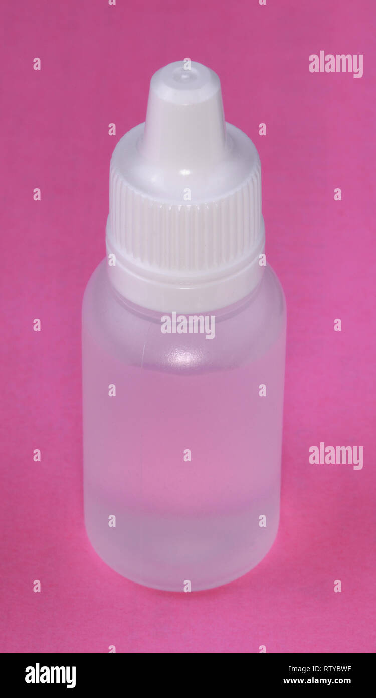 White Plastic Vial on Pink Background Stock Photo - Alamy