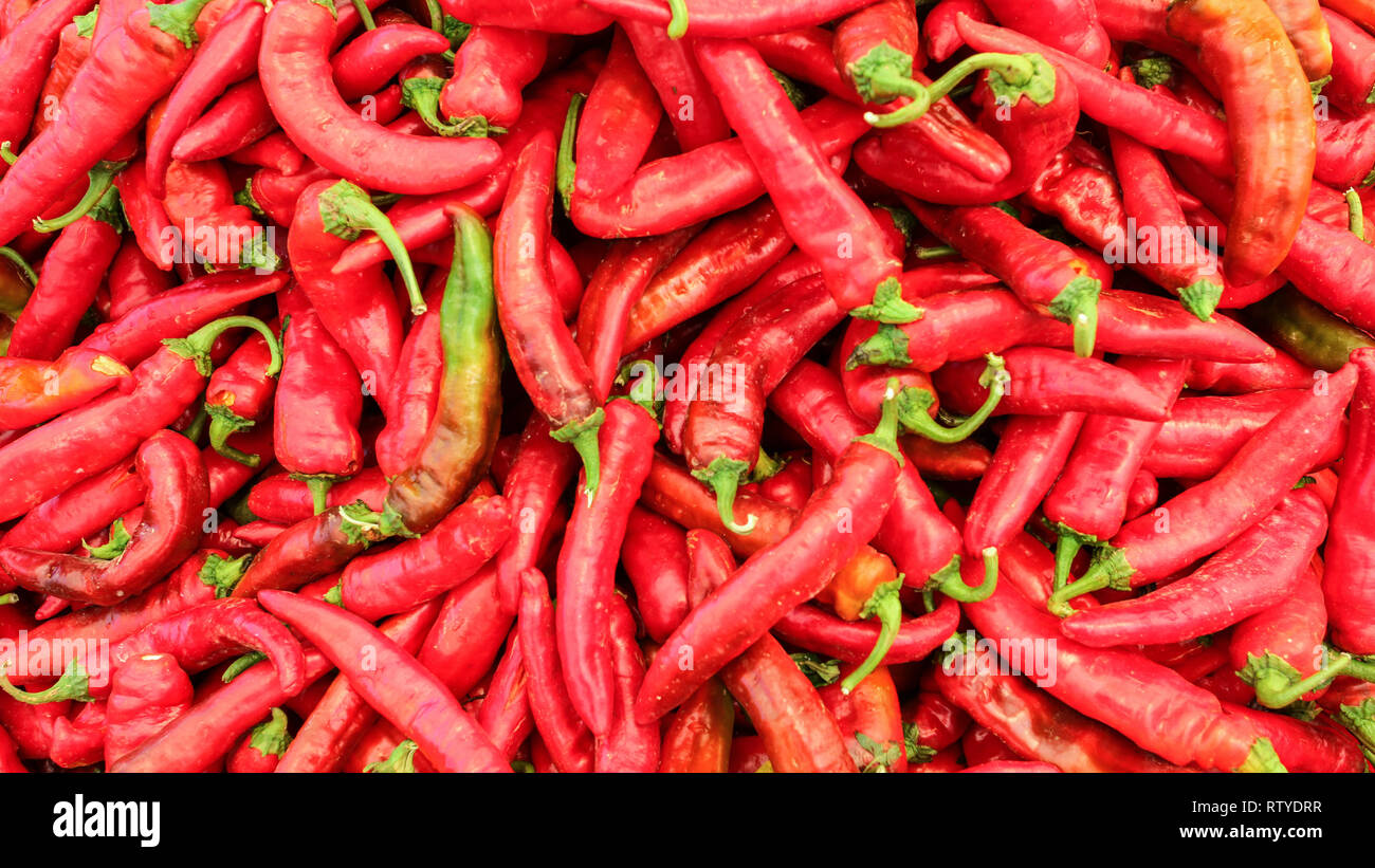 Top view on red pointed peppers displayed in food market Stock Photo ...