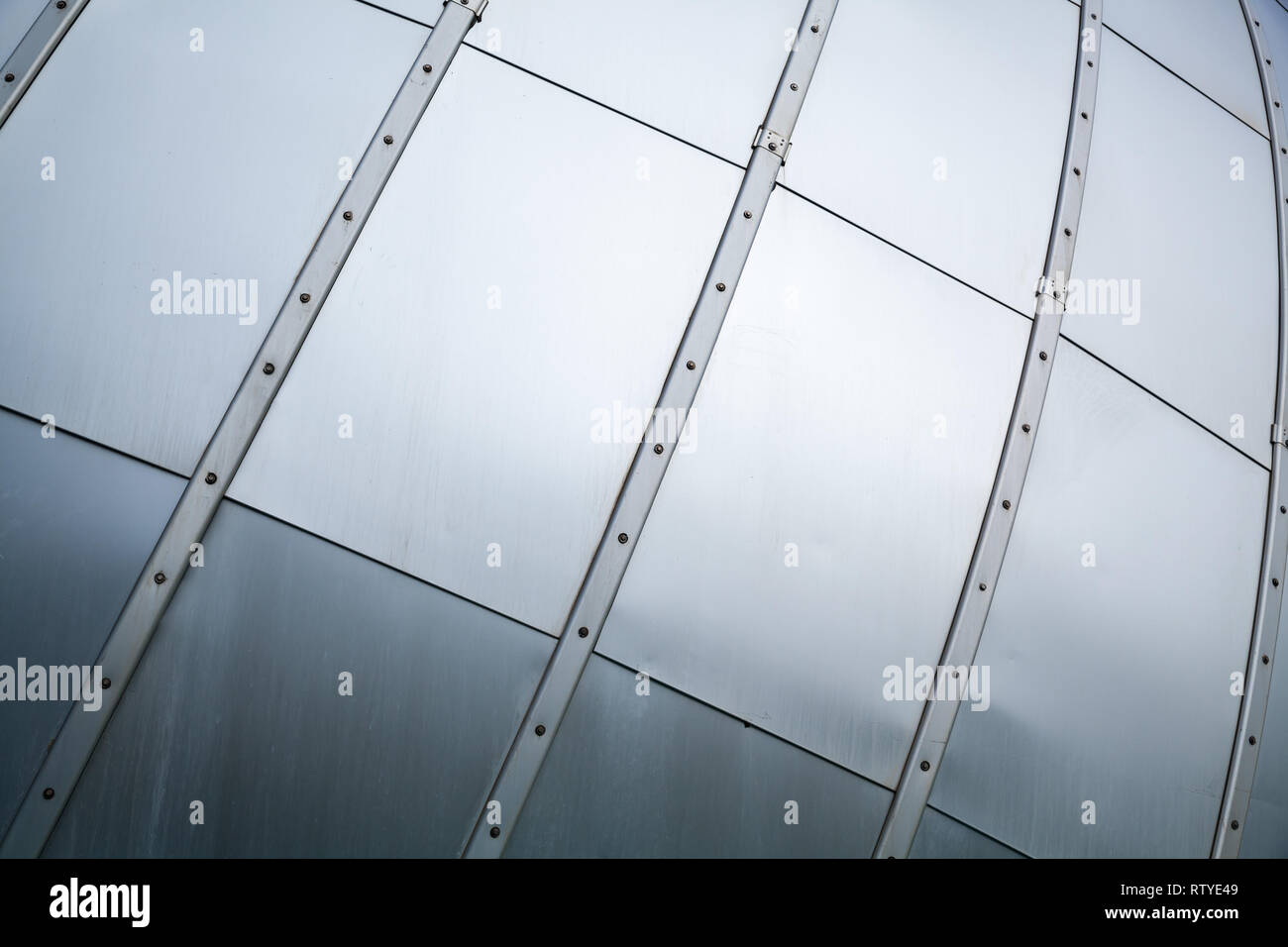Shiny modern spherical wall made of metal plates, abstract ...