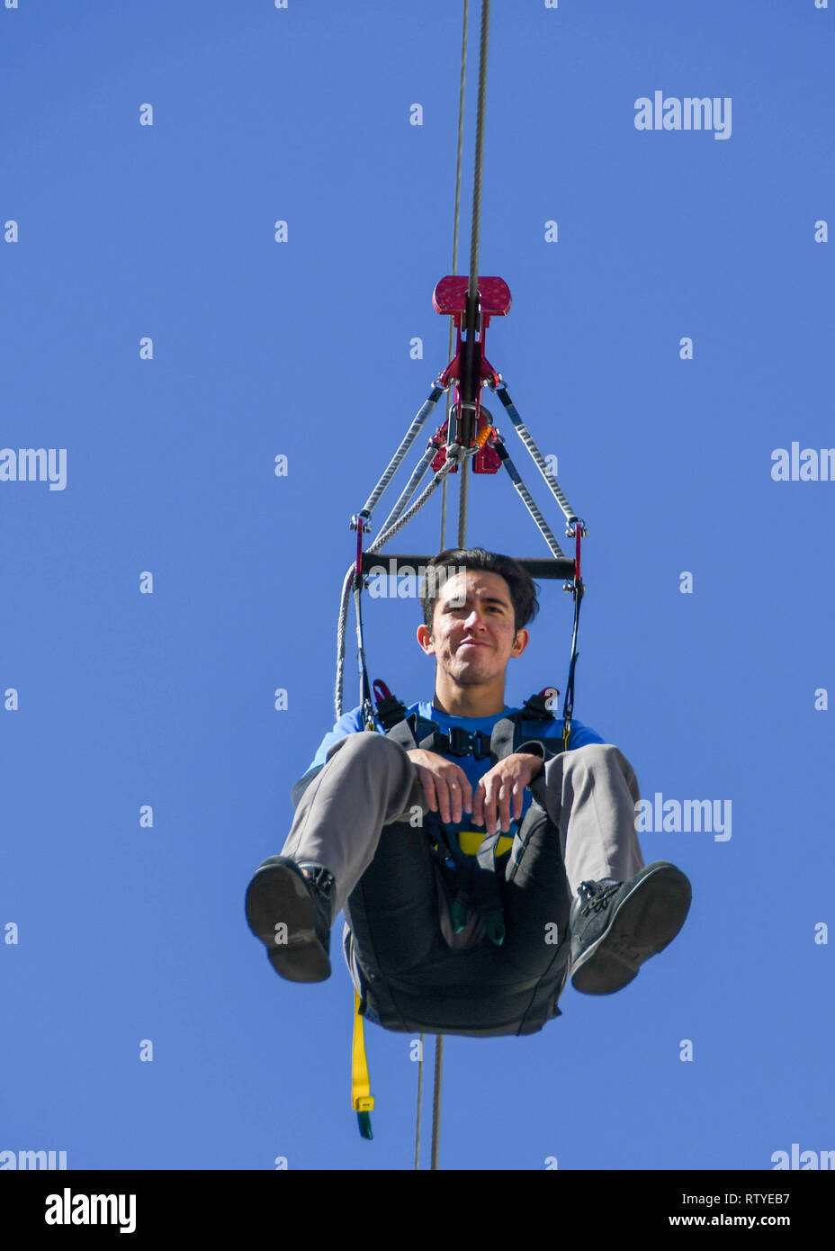 LAS VEGAS, NEVADA, USA - FEBRUARY 2019: Person riding on a zip wire in ...
