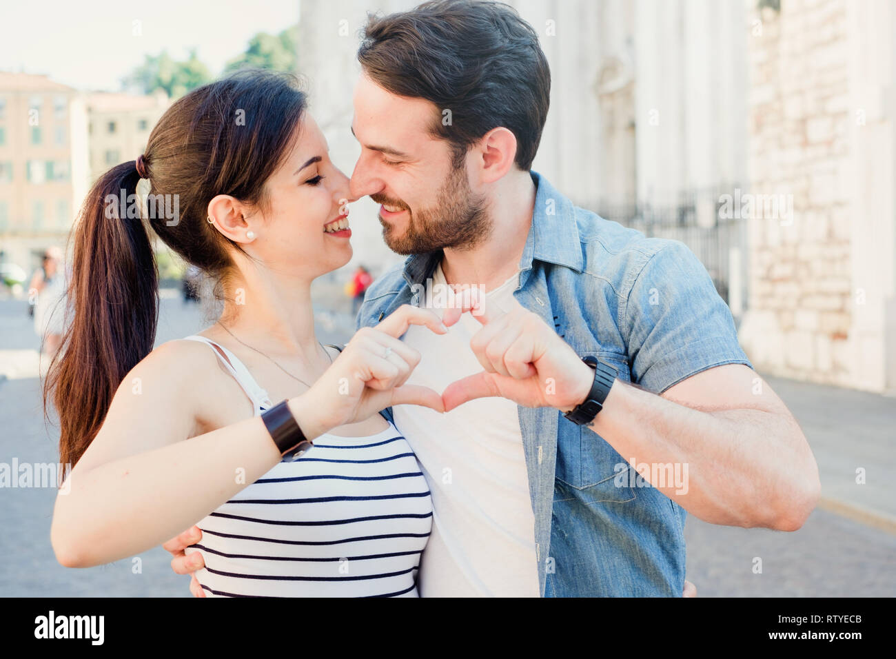 Cheerful couple falling in love in the city Stock Photo - Alamy