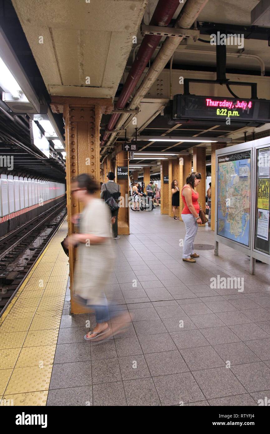NEW YORK, USA - JULY 4, 2012: People wait at subway station in New York ...