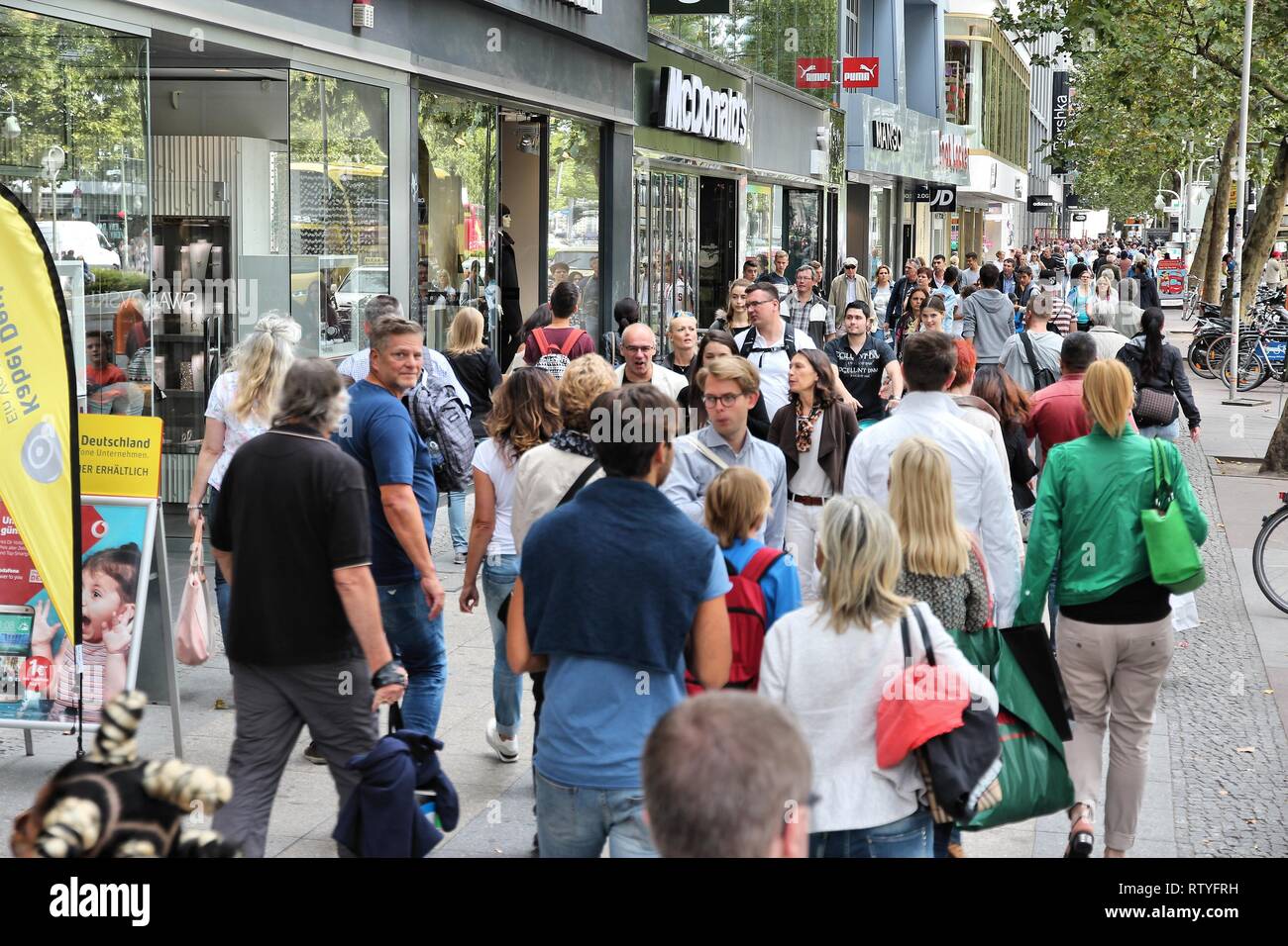 BERLIN, GERMANY - AUGUST 27, 2014: People shop at famous Kurfurstendamm ...