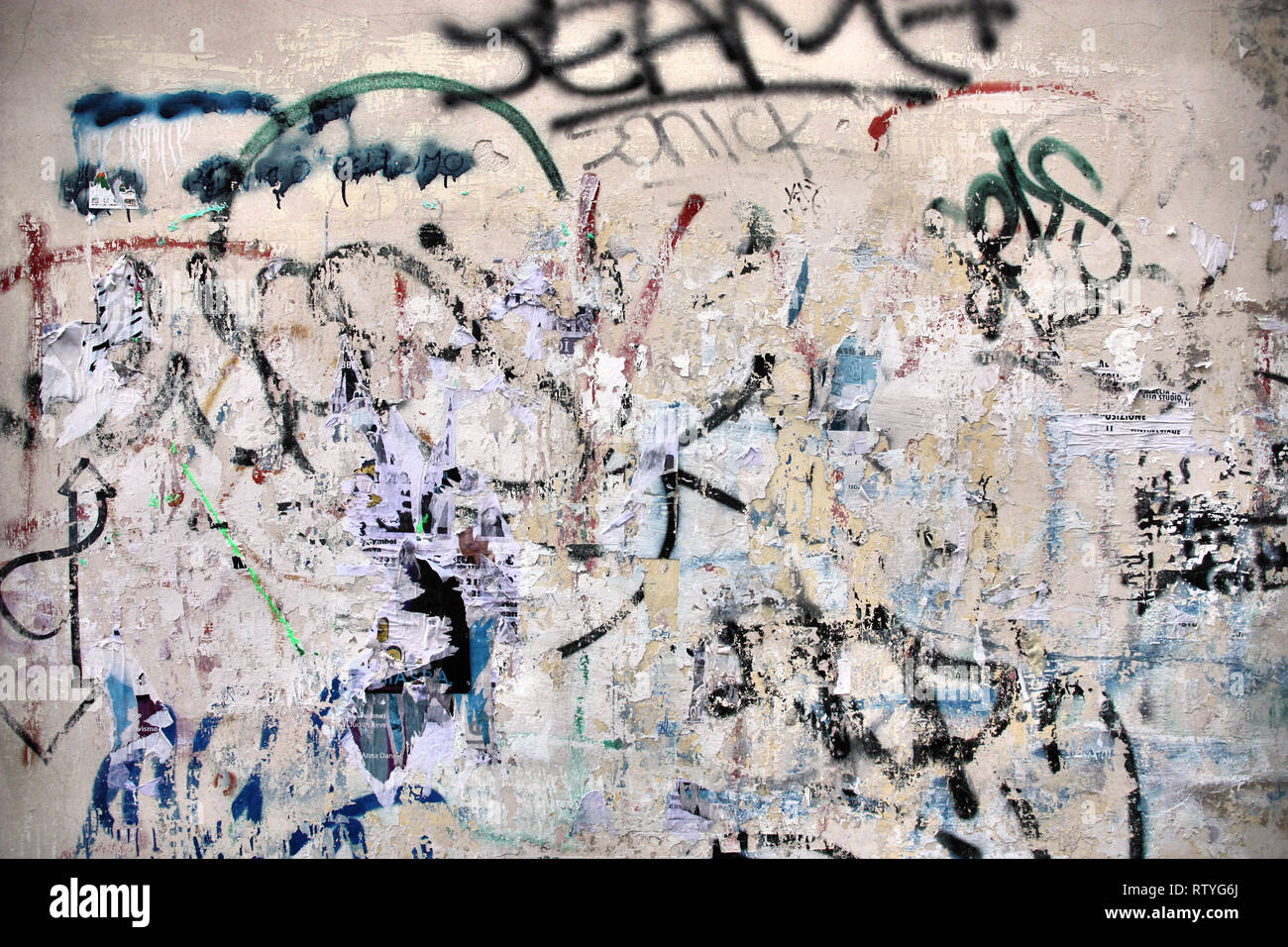 Torn posters on old wall, vandalism and urban decay Stock Photo - Alamy